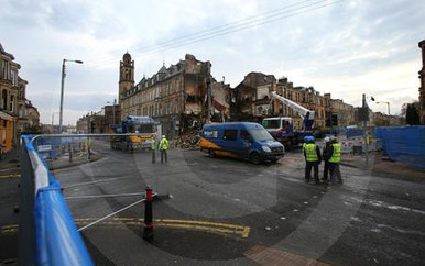 38365451-Pictured are workers from Reigart making a tenement block safe ...
