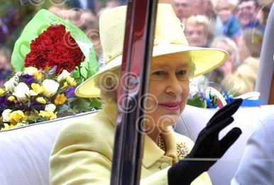 39577839-The Queen waves to the crowds from the Royal car as she passes ...