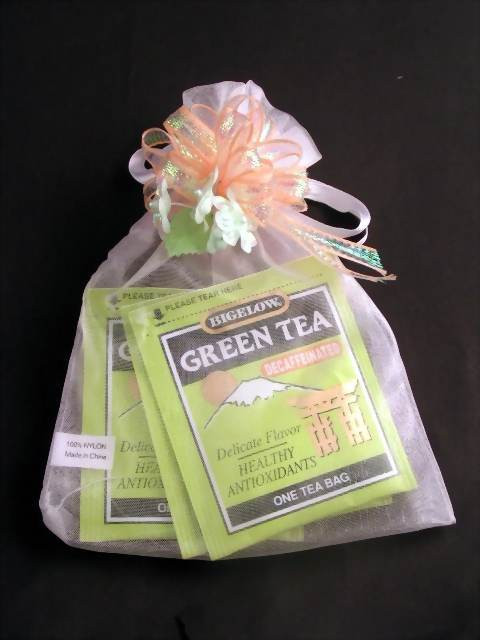 Fancy Herbal Tea Assortment in a bag wrapped w/Fancy Ribbon & Flowers