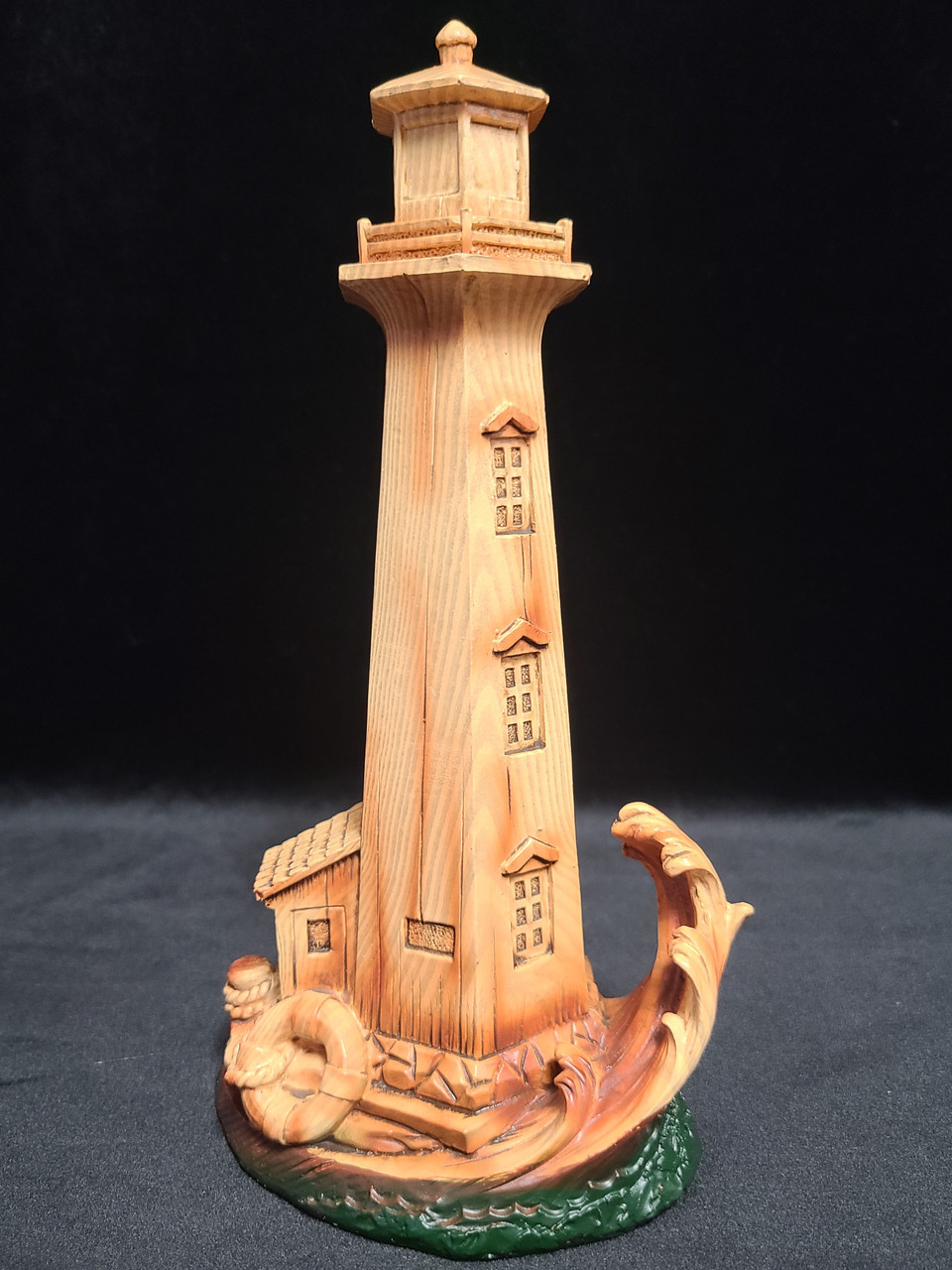 Carved wood lighthouse & preserver statue - Ponce Inlet Lighthouse Locker