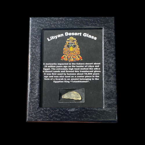 Libyan glass specimen in glass case