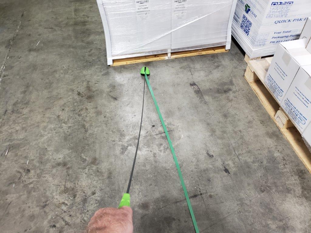 Easy Strapping with the light weight Strap Feeder - Quick Pak, Inc.