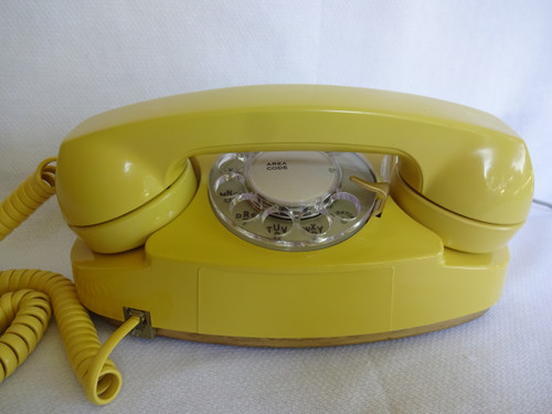 Yellow princess rotary phone made by Western Electric | Old Phone Shop
