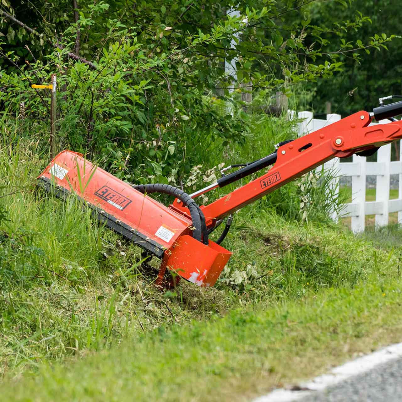 Raptor Mounted Sidewinder Flail Mower | Eterra Attachments
