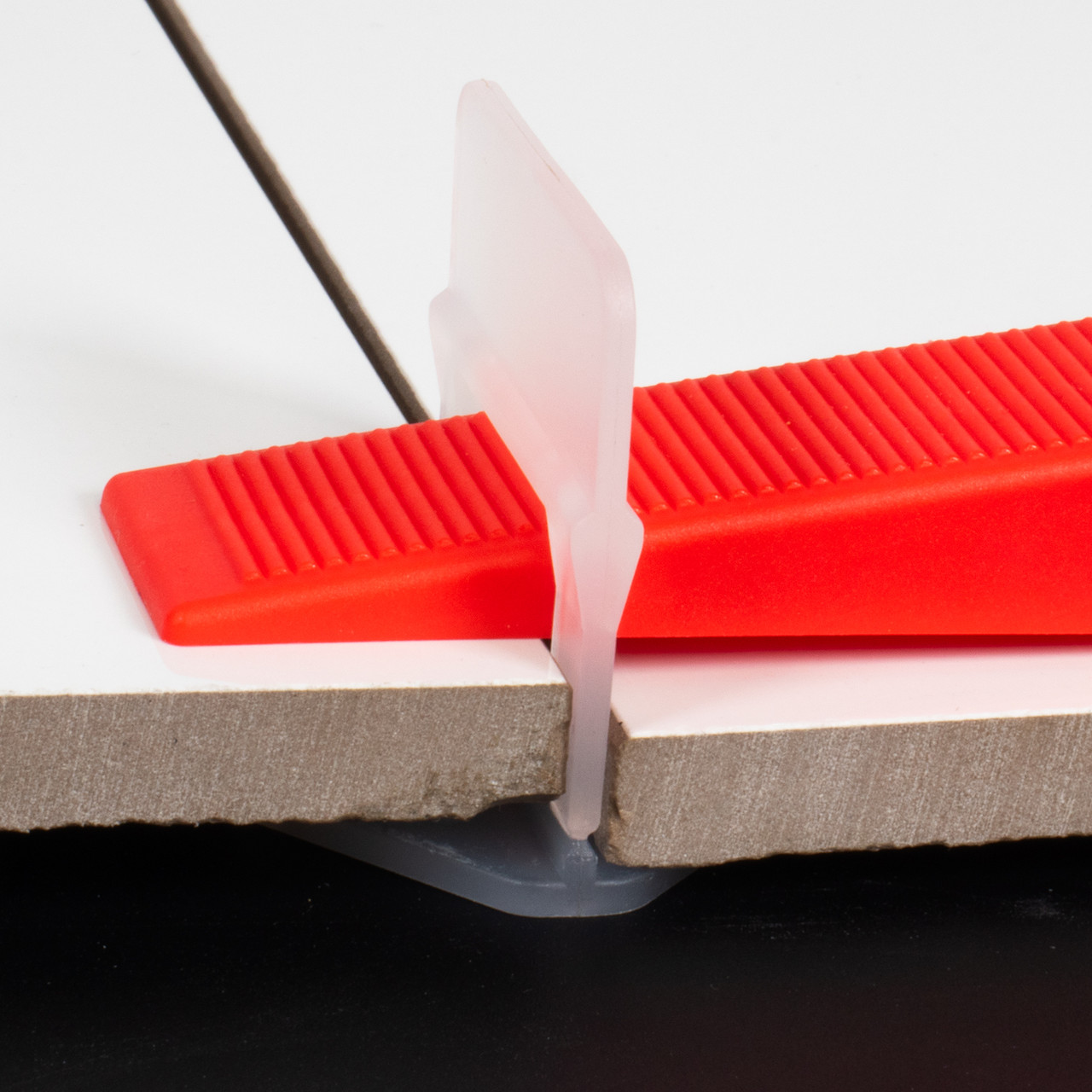TekTools Tile Levelling System Spacer Clips Reusable Wedges Pliers and a TekTools Drawstring Bag The Wetroom Store