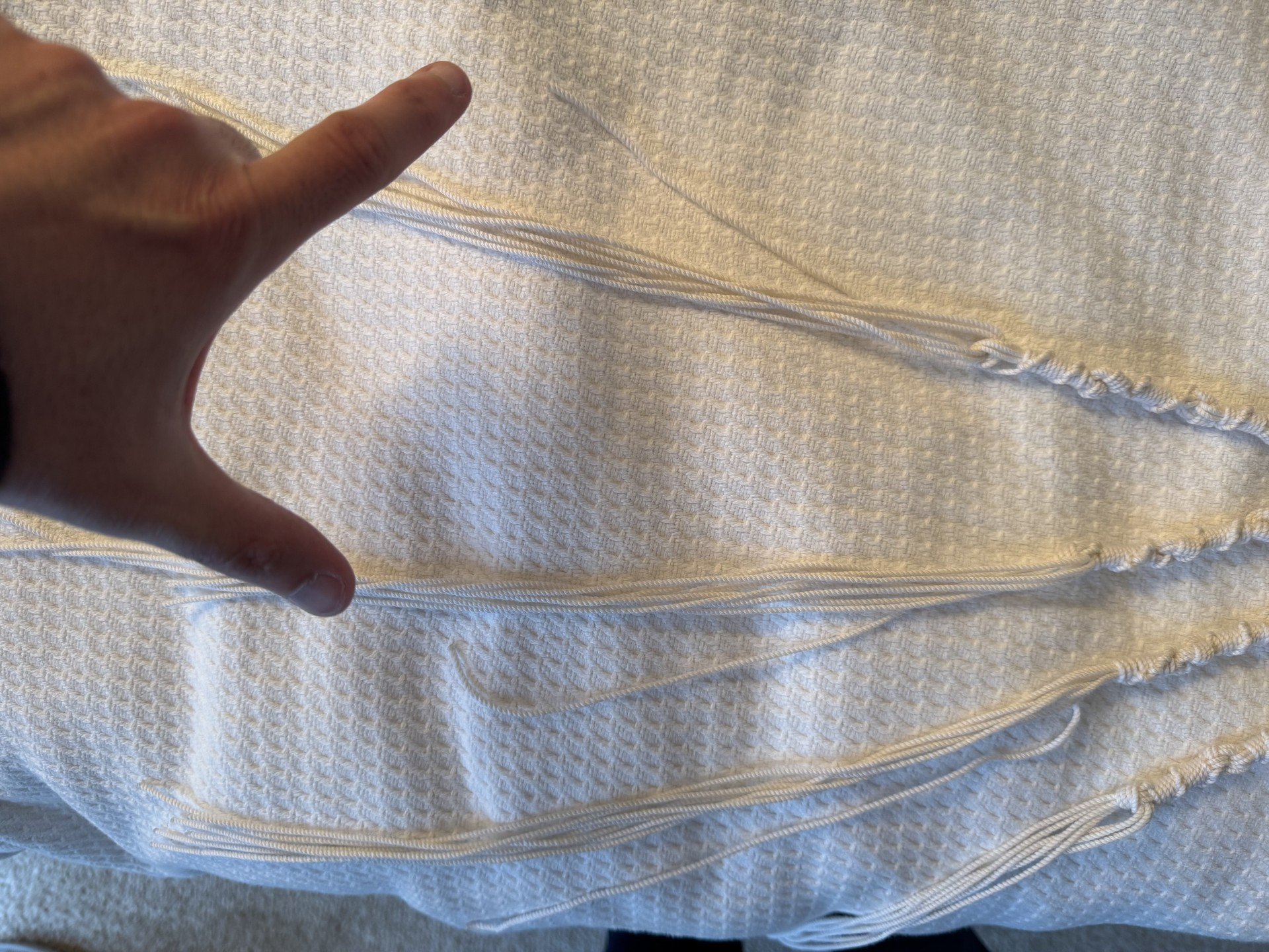 One tzitzit string that's shorter than the rest - Ben's Tallit Shop