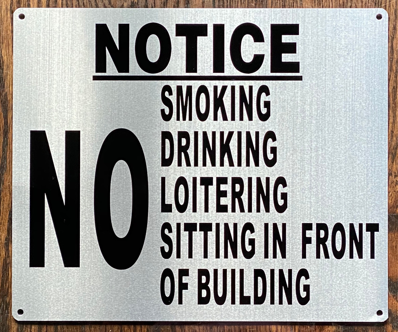 DO NOT SIT ON Steps in Front of Building Sign