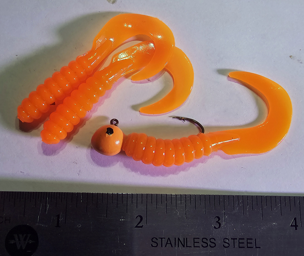 Round Jig 1/4 oz with Orange Head and 3-3" Orange Grub Tails