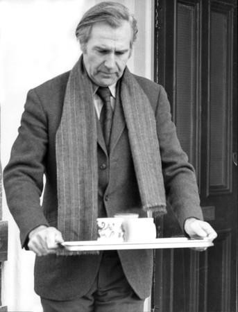 39120489-John Stonehouse brings out three cups of coffee for Geoffrey ...