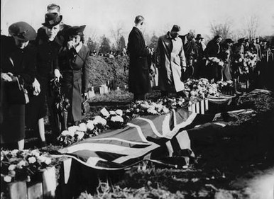 38534477-World War II. Mass burial of Coventry raid victims. A group of ...