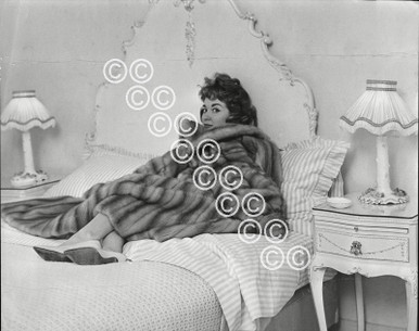 34607915-Marion Ryan, singer in mink fur coat on bed, 1960 ...