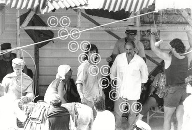 34866847-Actor Sylvester Stallone surrounded by his bodyguards on the ...