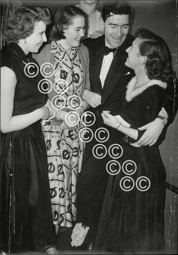 34914889-Film star Robert Beatty chatting to three girls at the Weekend ...