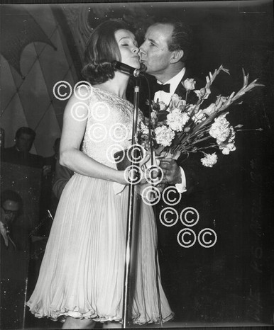 34914965-Actress singer comedienne Millicent Martin gets a kiss from ...