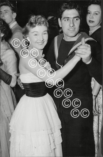 34914987-Actress Joan Dowling, dancing with a sailor at the Weekend ...
