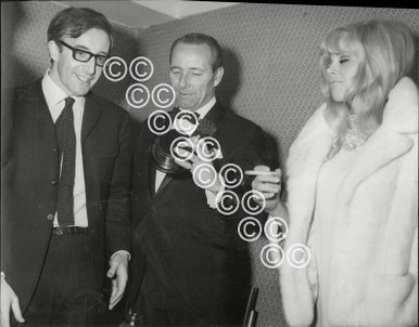 34915023-L-R: Actor Peter Sellers, Weekend editor David Hill, and ...