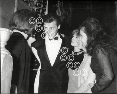 34915039-Actor Roger Moore surrounded by fans at the Weekend Mail Ball ...