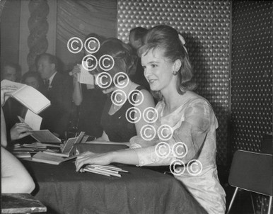 34915043-L-R: Singer Louise Cordet and actress Diana Beevers, signing ...
