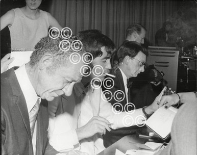 34915290-L-R: Actors Sid James, John Alderton and Charles Hawtrey, sign ...