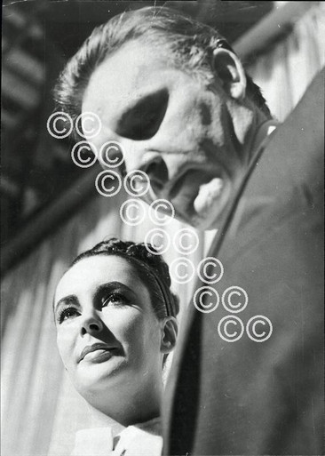 35114514-Actress Elizabeth Taylor, and Richard Burton on the set of VIP ...