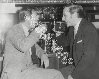 36311984-Michael Medwin has a pint with fellow actor John Neville in a ...