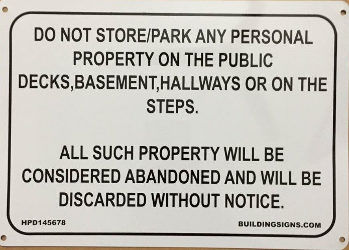 NO STORAGE IN HALLWAY SIGN