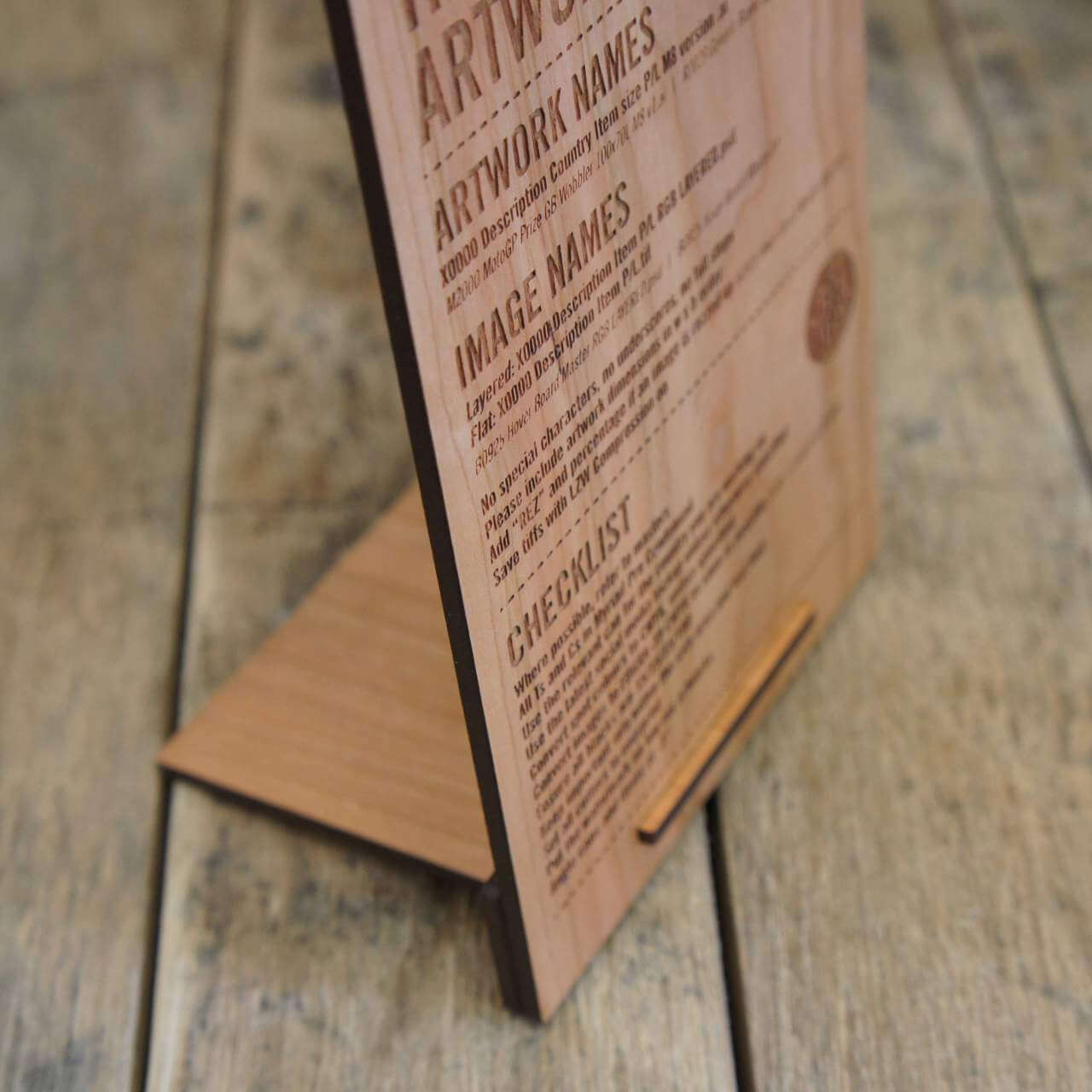 Cam Graphic: engraved wooden self standing sign