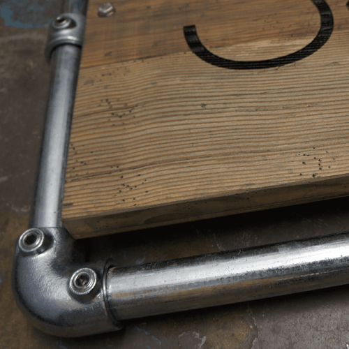 Cam Graphic: industrial look wooden sign with metal surround