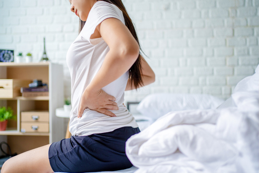 Back Pain During Your Period - Wombilee