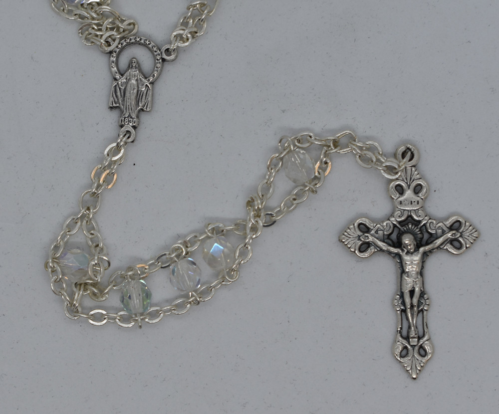 This ladder rosary has 6mm clear crystal glass beads and was made in Italy.