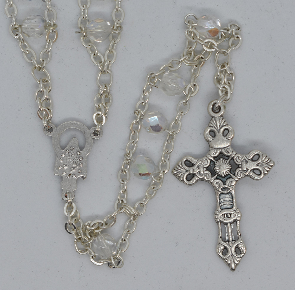 This ladder rosary has 6mm clear crystal glass beads and was made in Italy.