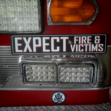 Taylor's Tins™ Expect Fire and Victims Metal Sign A