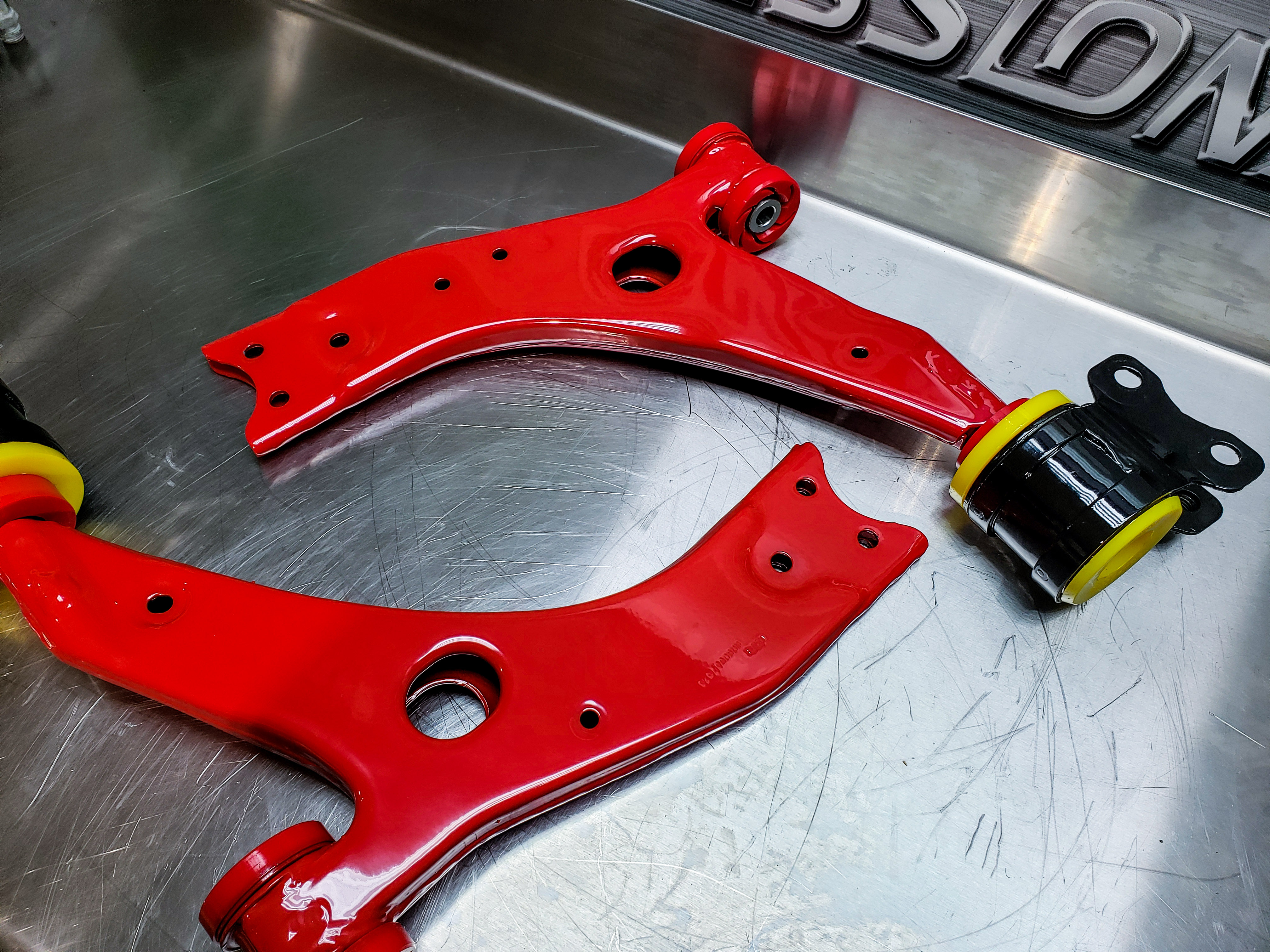 Front Lower Control Arms POLYBUSHED - Focus On Performance