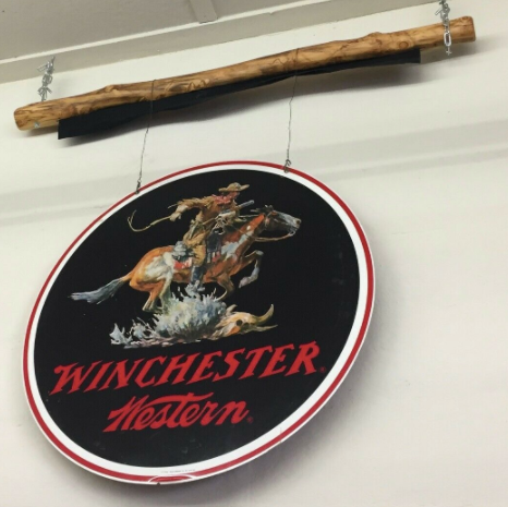 A Collectible Vintage Winchester Sign