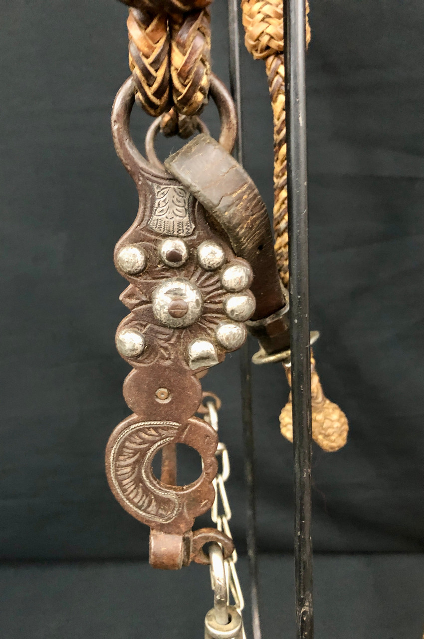 A Great Old Rawhide/Calfskin Braided Bridle with Kissing Bird Bit