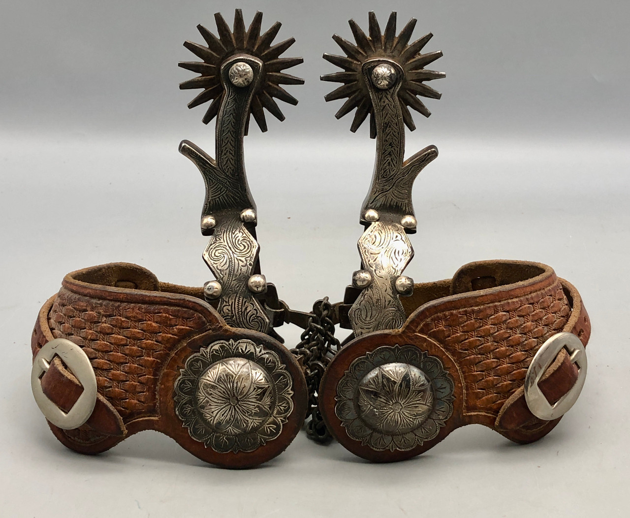 Fancy Pair of Diamond and Dot Pattern Spurs With Nice Straps
