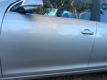 VW JETTA USED LHF DOOR SKIN IN SILVER LA7W CODE