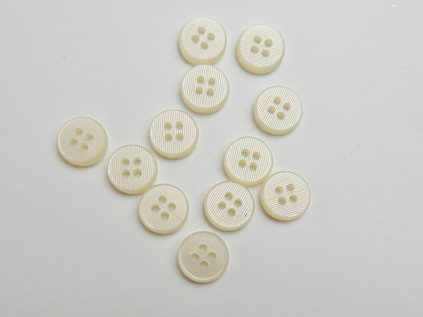 12 Off white textured shirt button, size 18 - Islander Sewing