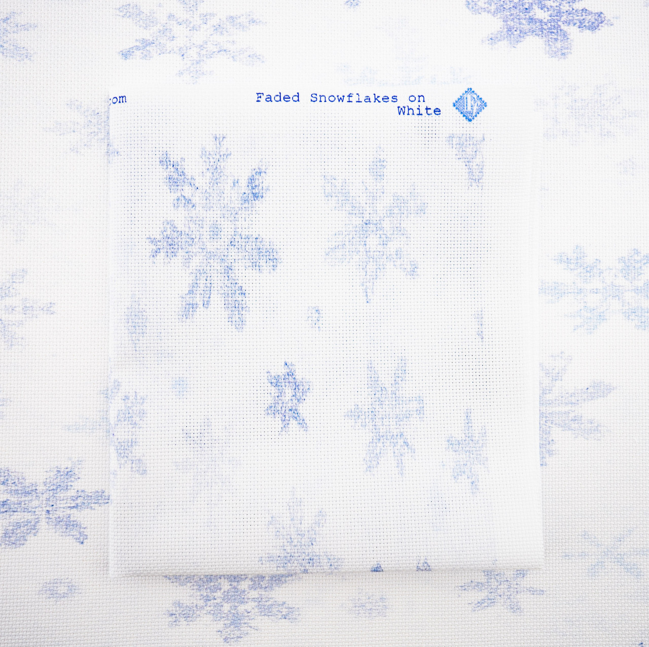 Faded Snowflakes on White Cross Stitch Fabric