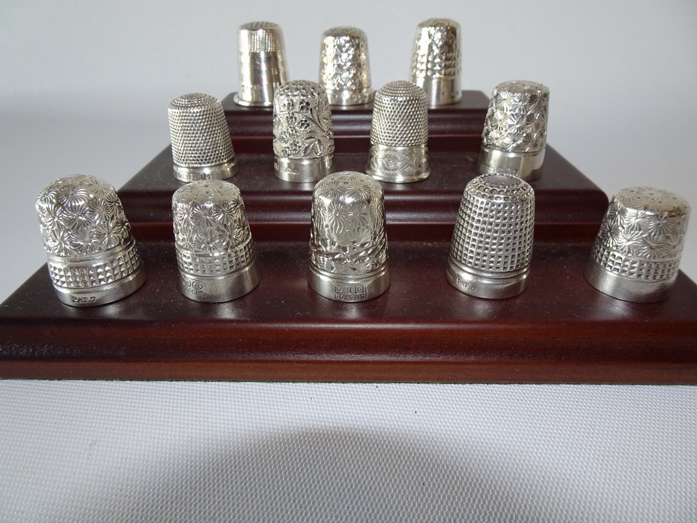 Set of 12 Antique and Vintage Thimbles on Wooden Stand