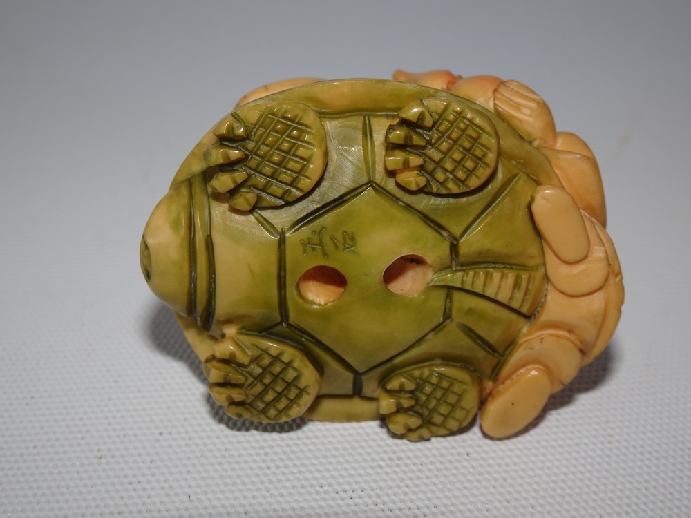 Japanese Nut Ivory Netsuke of Man and Boy Riding a Turtle