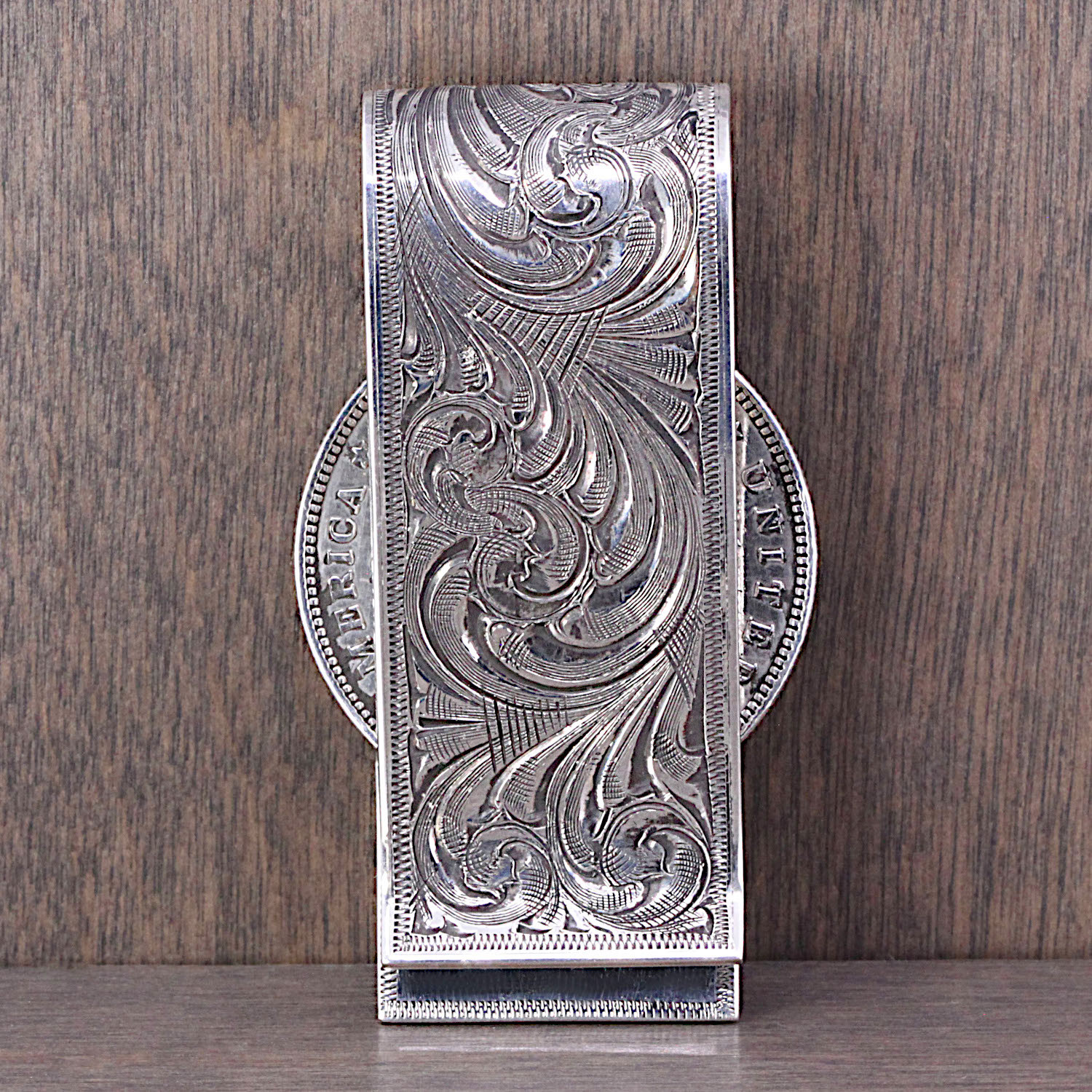 Hand made sterling silver money clips featuring western scroll engraving.