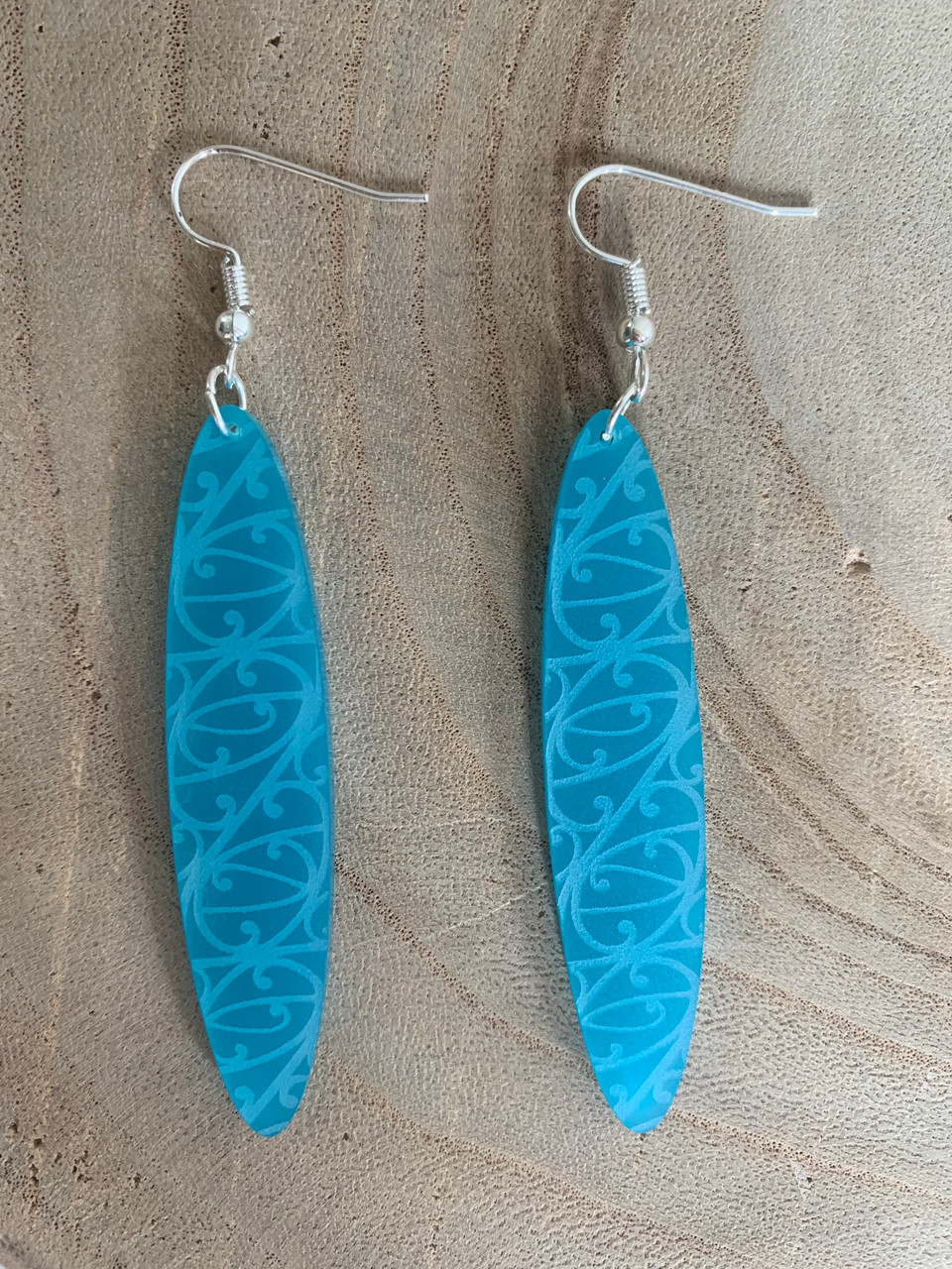 Aqua blue acrylic earrings with pitau design - Adore Collection