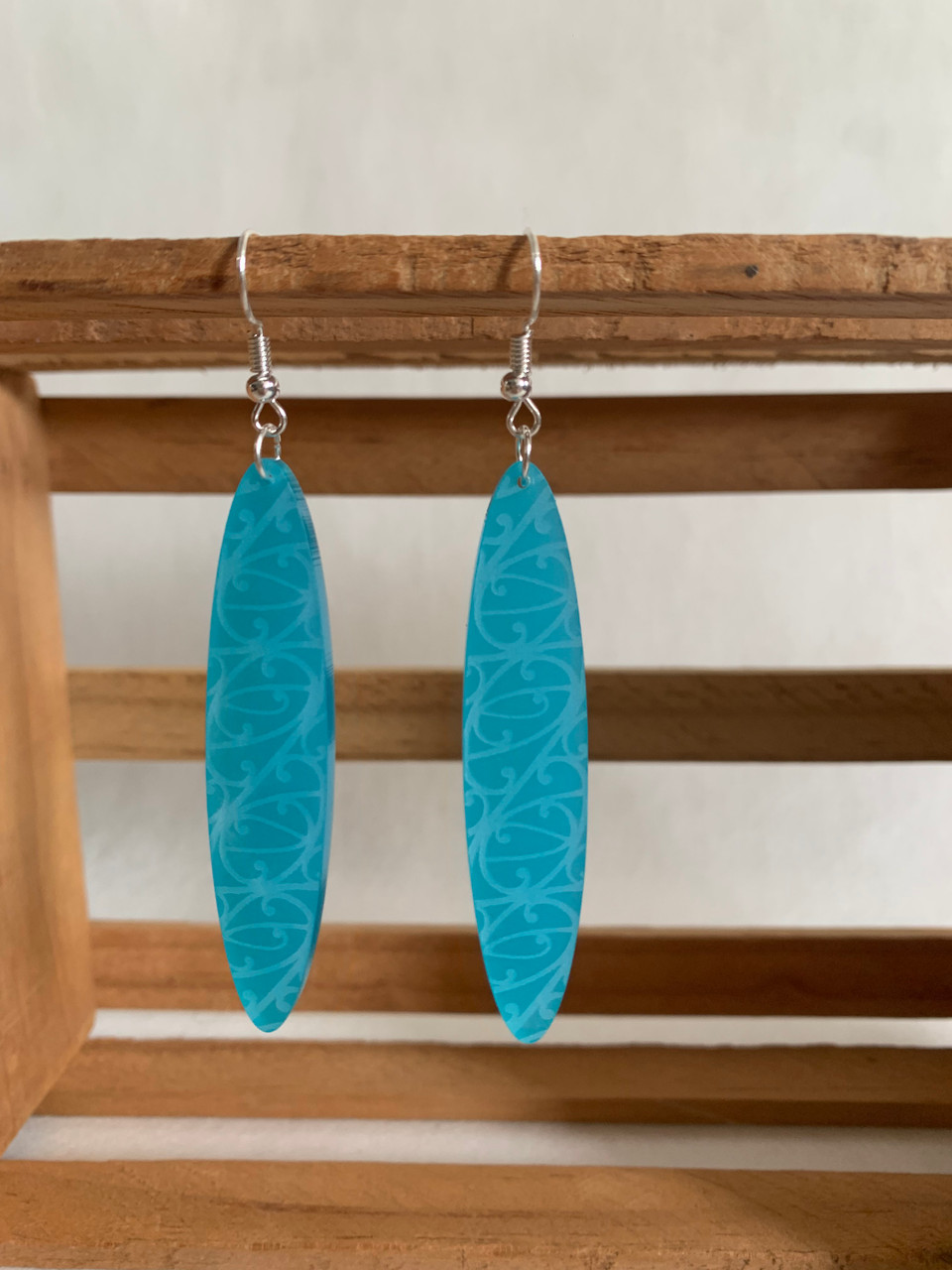 Aqua blue acrylic earrings with pitau design - Adore Collection