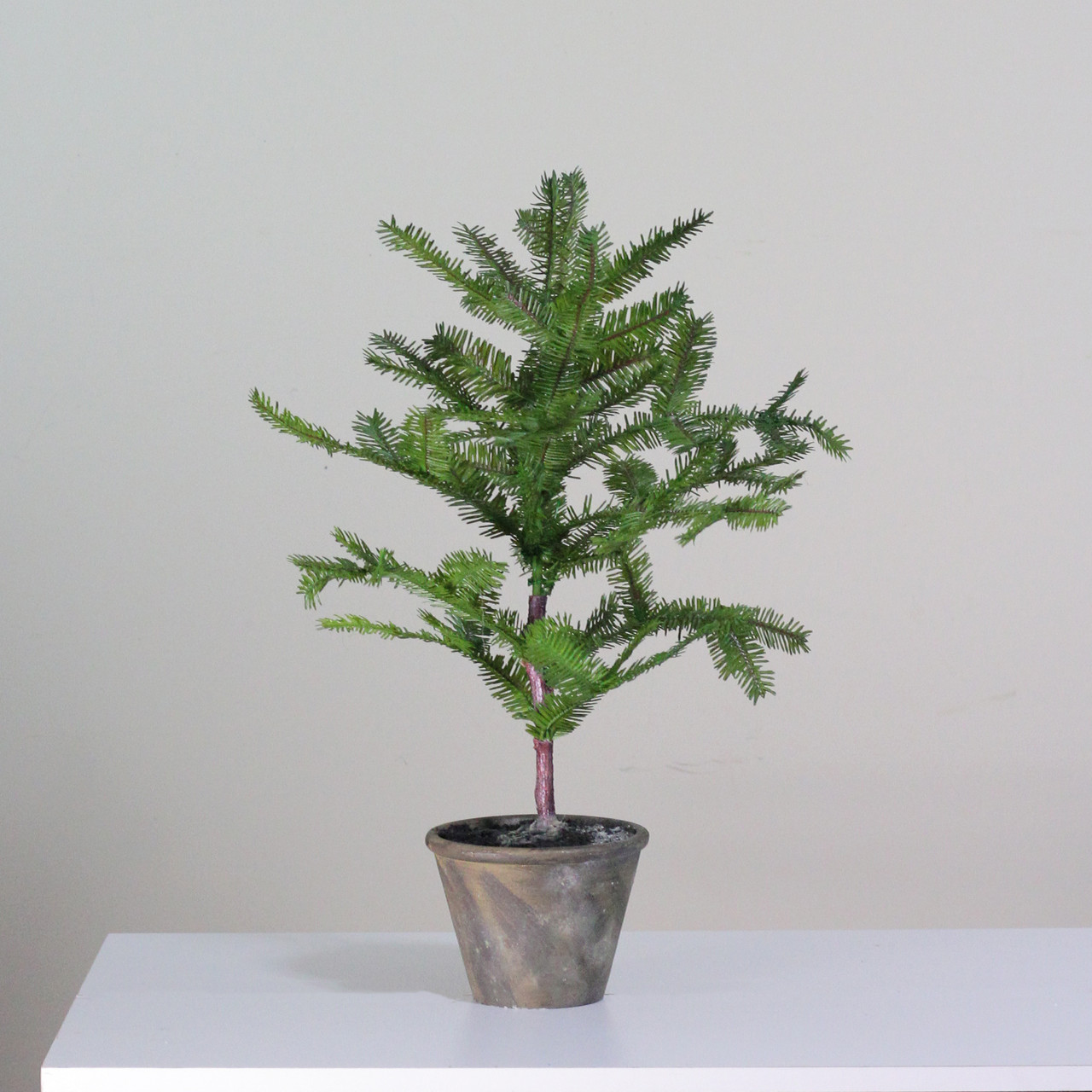 22" Green Artificial Mini Pine Tree in Paper Mache Pot | Christmas Central
