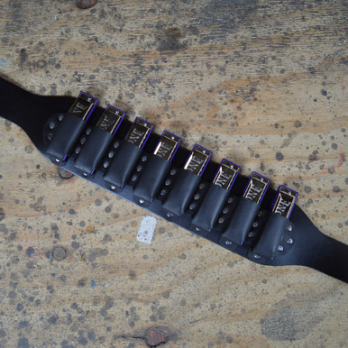 Leather hamonica belt. Can hold up to 8 harps. \n \n Buckle adjustable ...