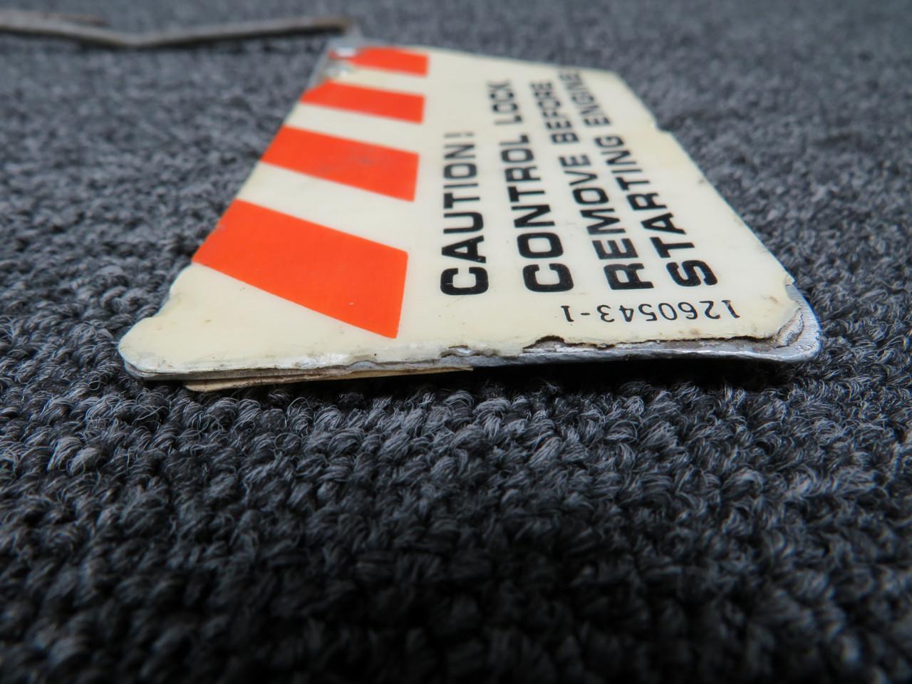 1260543-1 Cessna 210B Control Lock, Worn