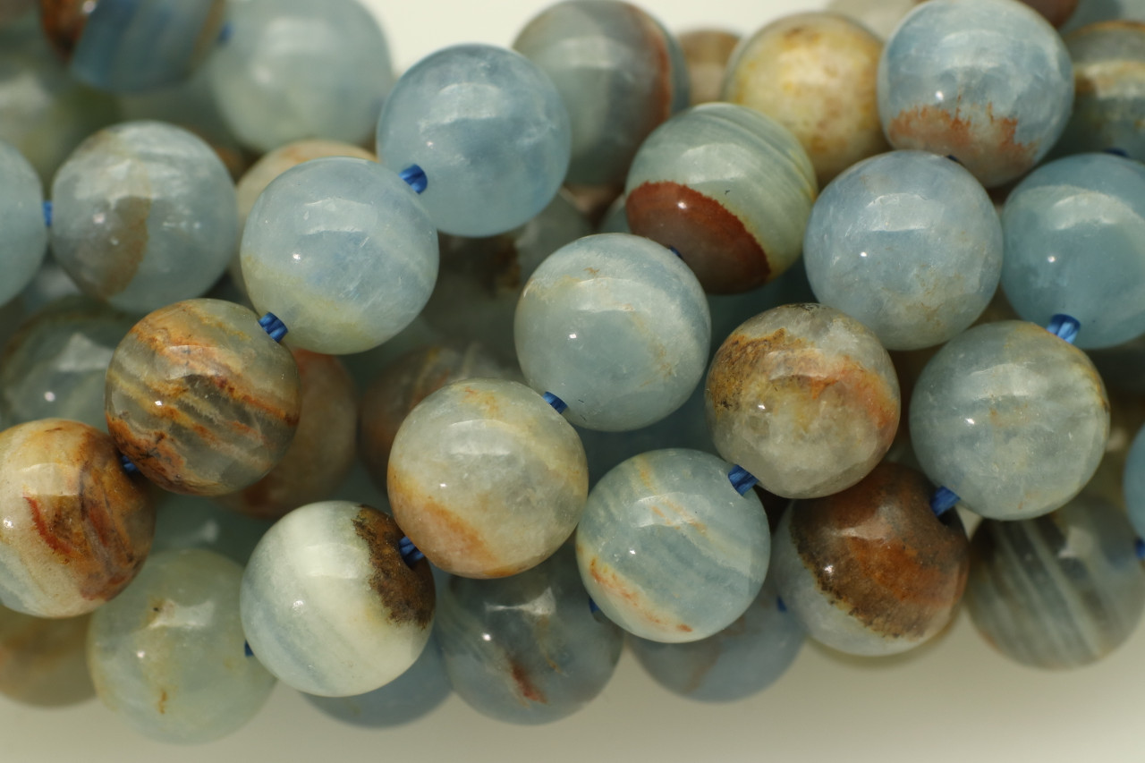 Selenite, Blue, Smooth Round in sizes 6mm & 8mm. Price Per Strand