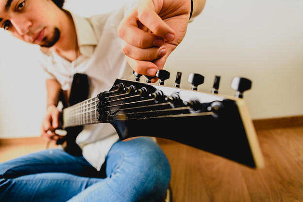 How to Fix String Buzz on an Electric Guitar - Strings and Beyond