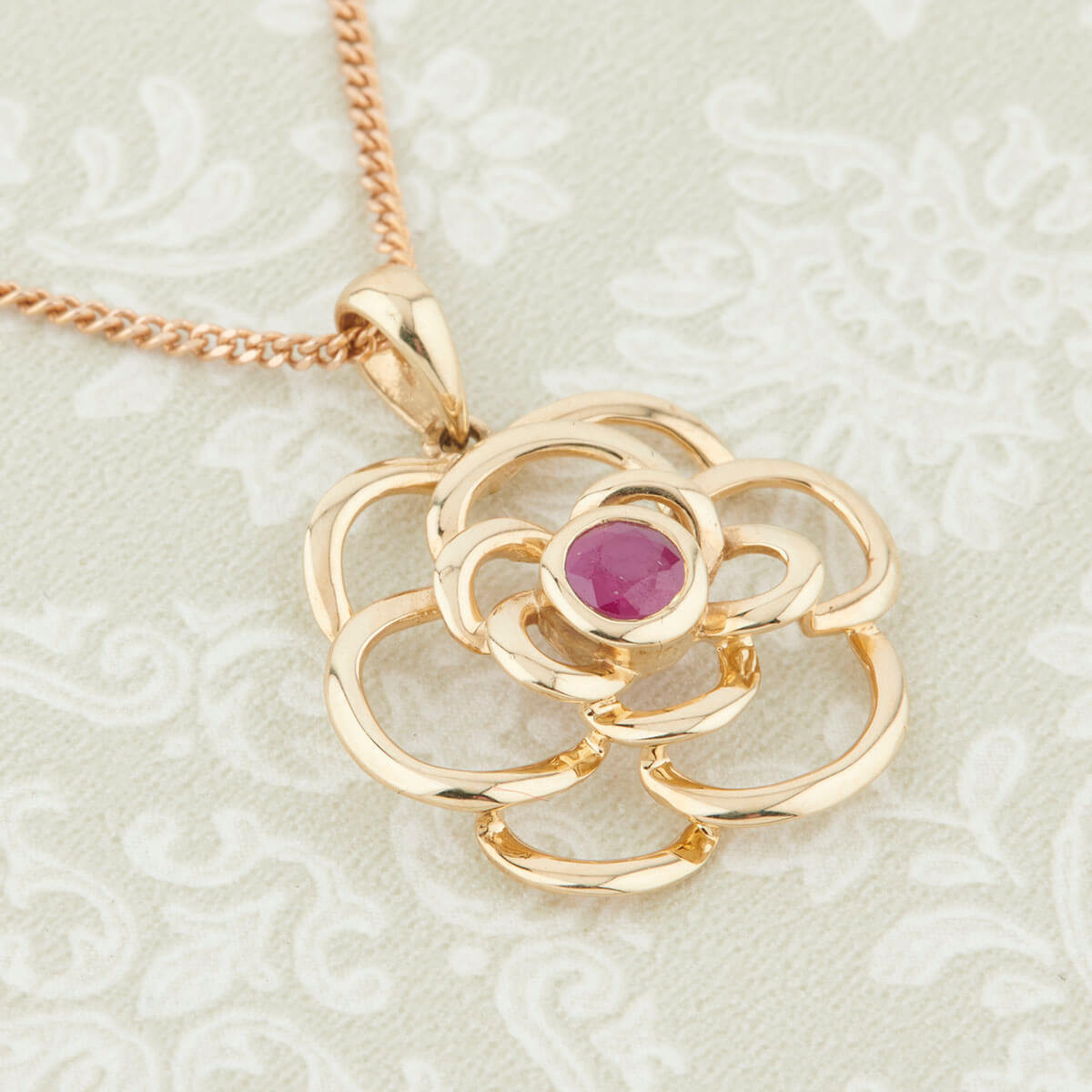 9ct Gold Ruby Flower Pendant and Chain | RH Jewellers